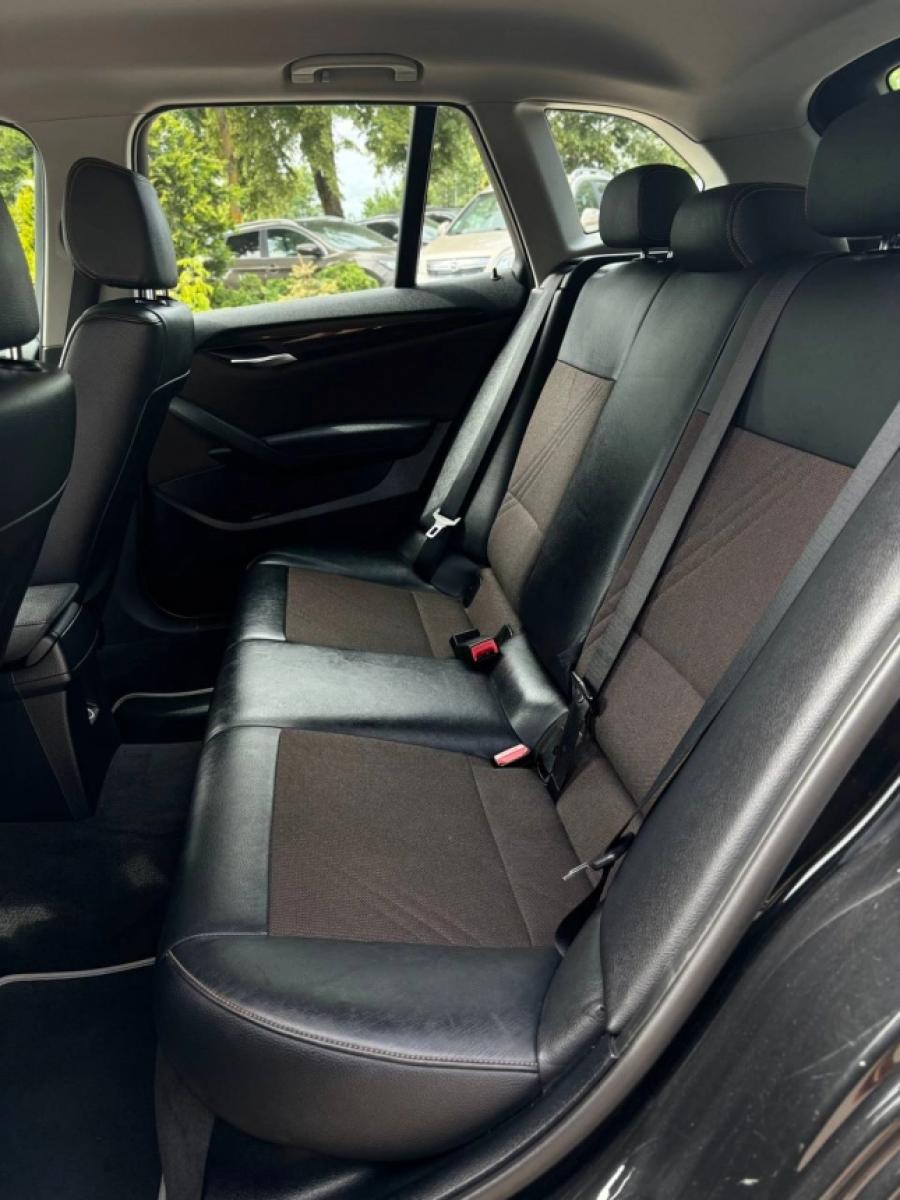 Black BMW X1 2013 in Riga, with an engine capacity of 2.00 L and mileage of 181 thousand km for 9499 €, photo 23 on AUTOMOTO.COM.LV