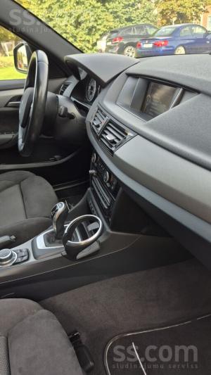 Black BMW X1 2013 in Liepaja, with an engine capacity of 2.00 L and mileage of 230 thousand km for 9850 €, photo 13 on AUTOMOTO.COM.LV