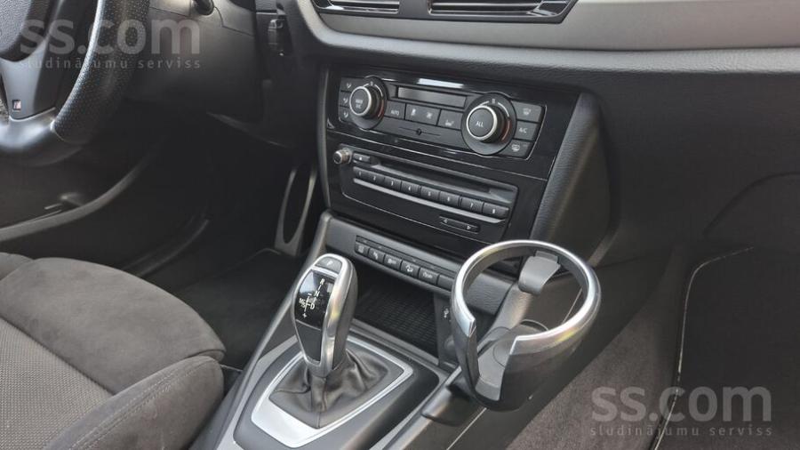 Black BMW X1 2013 in Liepaja, with an engine capacity of 2.00 L and mileage of 230 thousand km for 9850 €, photo 14 on AUTOMOTO.COM.LV