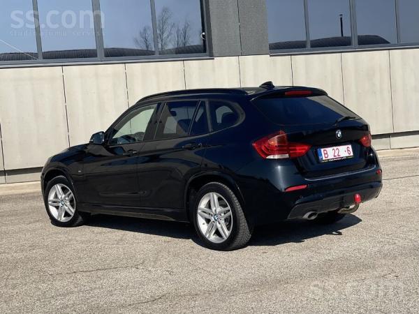 Black BMW X1 2014 in Riga, with an engine capacity of 2.00 L and mileage of 199 thousand km for 11190 €, photo 4 on AUTOMOTO.COM.LV