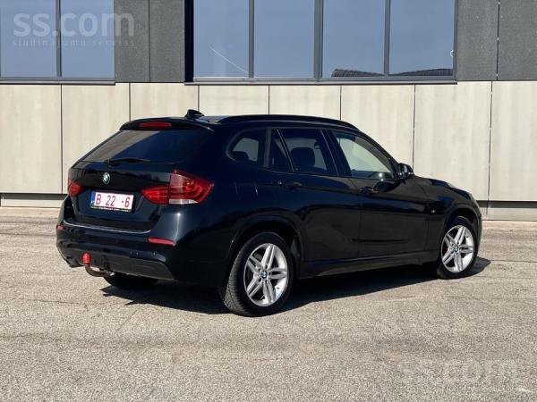 Black BMW X1 2014 in Riga, with an engine capacity of 2.00 L and mileage of 199 thousand km for 11190 €, photo 6 on AUTOMOTO.COM.LV