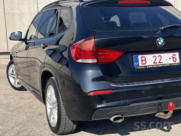 Black BMW X1 2014 in Riga, with an engine capacity of 2.00 L and mileage of 199 thousand km for 11190 €, photo 10 on AUTOMOTO.COM.LV