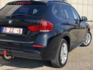 Black BMW X1 2014 in Riga, with an engine capacity of 2.00 L and mileage of 199 thousand km for 11190 €, photo 12 on AUTOMOTO.COM.LV
