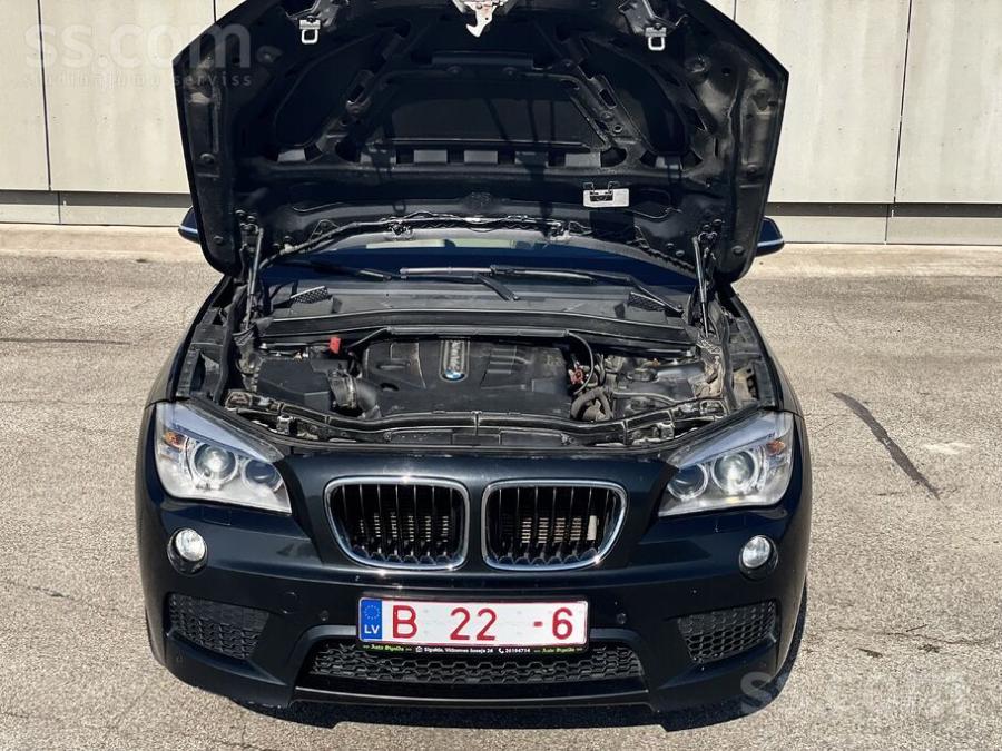 Black BMW X1 2014 in Riga, with an engine capacity of 2.00 L and mileage of 199 thousand km for 11190 €, photo 14 on AUTOMOTO.COM.LV