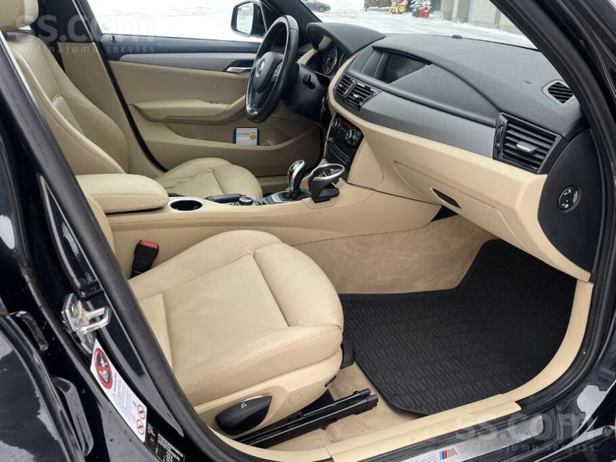 Black BMW X1 2014 in Riga, with an engine capacity of 2.00 L and mileage of 199 thousand km for 11190 €, photo 19 on AUTOMOTO.COM.LV