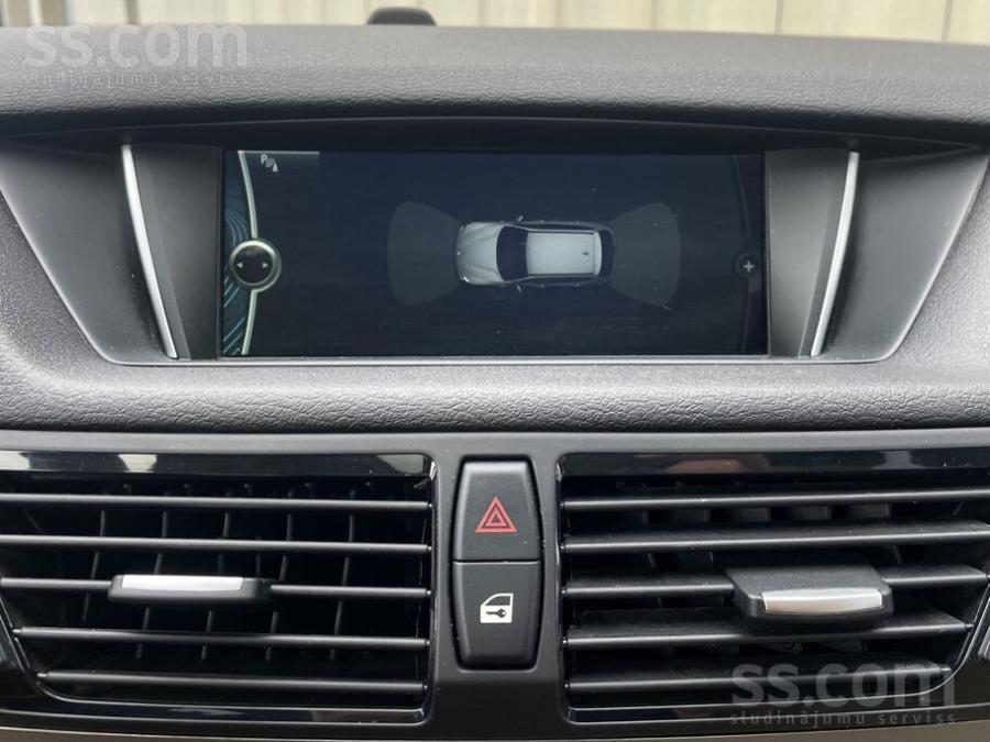 Black BMW X1 2014 in Riga, with an engine capacity of 2.00 L and mileage of 199 thousand km for 11190 €, photo 33 on AUTOMOTO.COM.LV