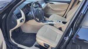 Black BMW X1 2014 in Riga, with an engine capacity of 2.00 L and mileage of 214 thousand km for 9300 €, photo 8 on AUTOMOTO.COM.LV