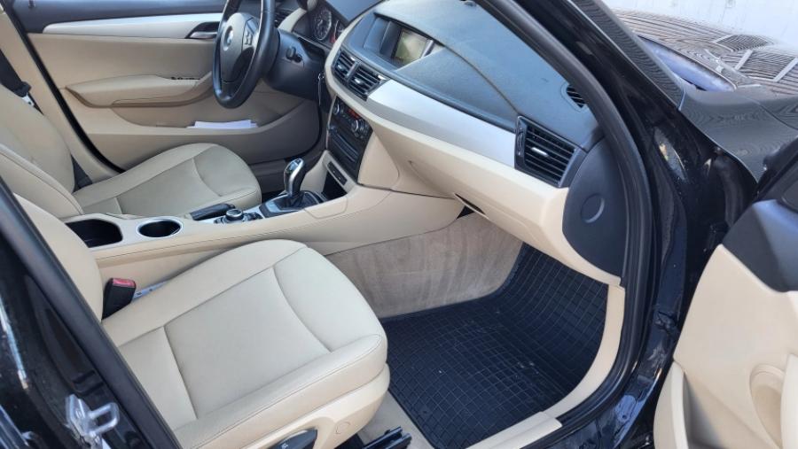 Black BMW X1 2014 in Riga, with an engine capacity of 2.00 L and mileage of 214 thousand km for 9300 €, photo 14 on AUTOMOTO.COM.LV