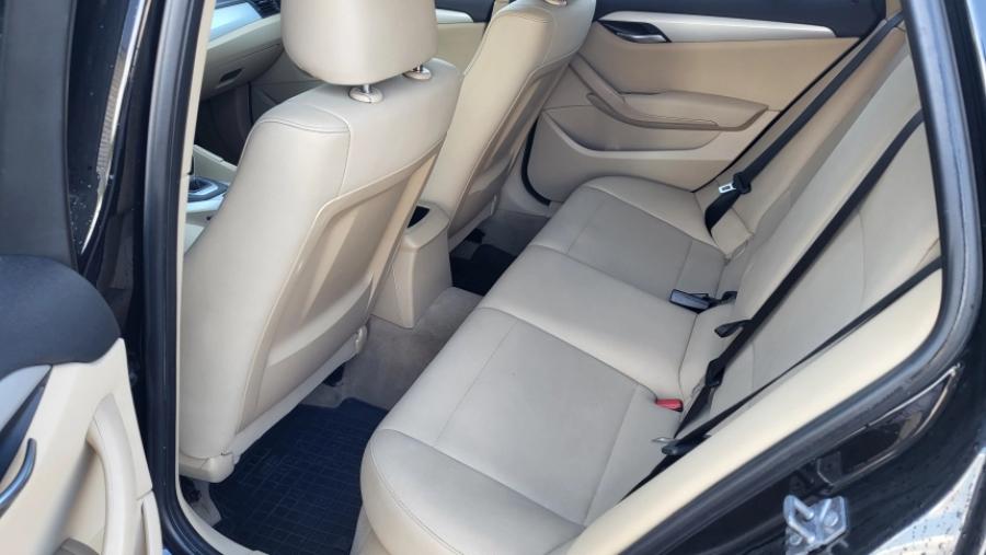Black BMW X1 2014 in Riga, with an engine capacity of 2.00 L and mileage of 214 thousand km for 9300 €, photo 15 on AUTOMOTO.COM.LV