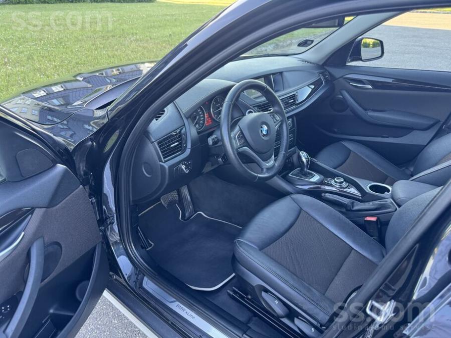 Black BMW X1 2015 in Cesis, with an engine capacity of 2.00 L and mileage of 290 thousand km for 8750 €, photo 13 on AUTOMOTO.COM.LV