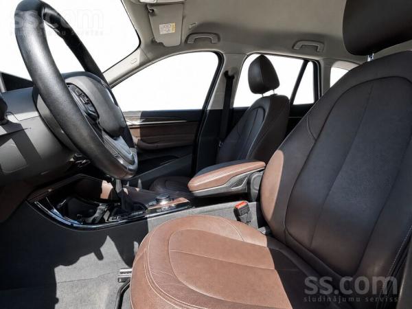 Black BMW X1 2016 in Riga, with an engine capacity of 2.00 L and mileage of 174 thousand km for 13990 €, photo 9 on AUTOMOTO.COM.LV