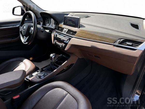 Black BMW X1 2016 in Riga, with an engine capacity of 2.00 L and mileage of 174 thousand km for 13990 €, photo 10 on AUTOMOTO.COM.LV