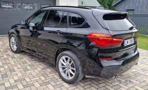 Black BMW X1 2017 in Riga, with an engine capacity of 2.00 L and mileage of 210 thousand km for 17500 €, photo 4 on AUTOMOTO.COM.LV