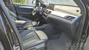 Black BMW X1 2022 in Liepaja, with an engine capacity of 2.00 L and mileage of 216 thousand km for 19990 €, photo 13 on AUTOMOTO.COM.LV