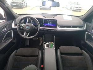 Black BMW X1 2023 in Vilnius, with an engine capacity of 1.50 L and mileage of 143 thousand km for 28315 €, photo 8 on AUTOMOTO.COM.LV
