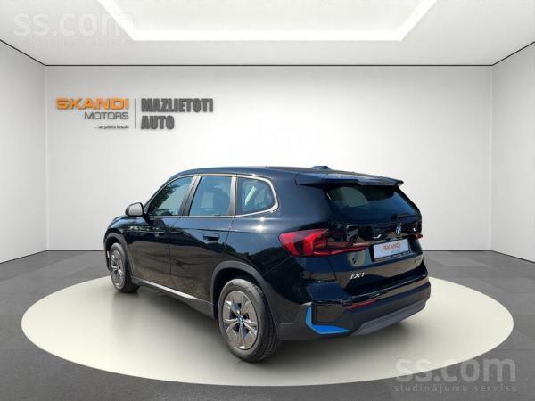 Black BMW X1 2023 in Riga, with an engine capacity of 0.00 L and mileage of 49 thousand km for 34990 €, photo 4 on AUTOMOTO.COM.LV