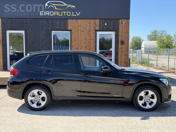 Black BMW X1 2014 in Riga, with an engine capacity of 2.00 L and mileage of 214 thousand km for 8950 €, photo 4 on AUTOMOTO.COM.LV