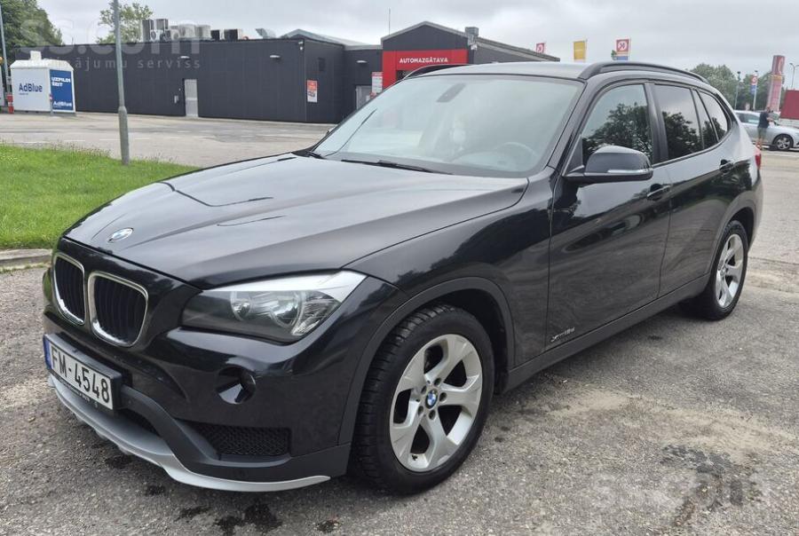 Black BMW X1 2014 in Riga, with an engine capacity of 2.00 L and mileage of 256 thousand km for 9100 €, photo 1 on AUTOMOTO.COM.LV