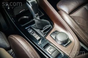 Blue BMW X1 2016 in Riga, with an engine capacity of 2.00 L and mileage of 284 thousand km for 11990 €, photo 14 on AUTOMOTO.COM.LV