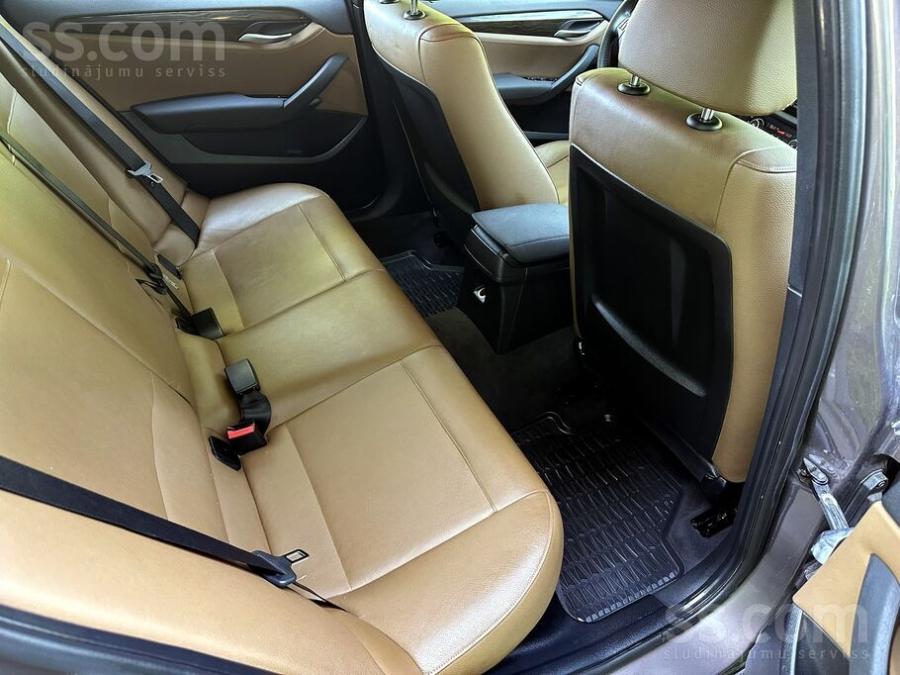Brown BMW X1 2012 in Riga, with an engine capacity of 2.00 L and mileage of 213 thousand km for 7900 €, photo 14 on AUTOMOTO.COM.LV