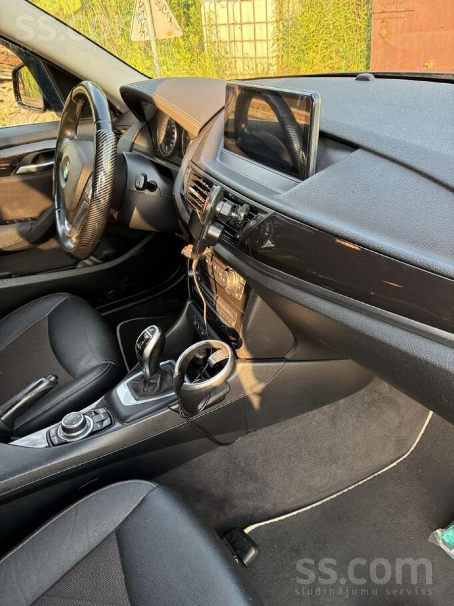 Brown BMW X1 2014 in Riga, with an engine capacity of 2.00 L and mileage of 169 thousand km for 10450 €, photo 5 on AUTOMOTO.COM.LV
