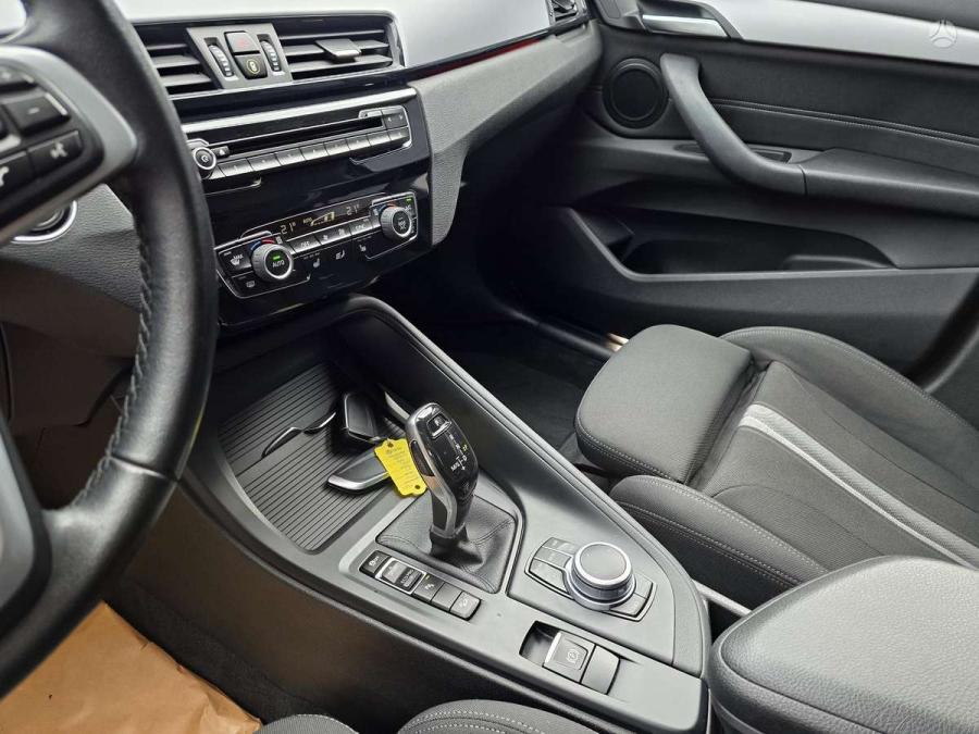 Grey BMW X1 2018 in Utena, with an engine capacity of 2.00 L and mileage of 271 thousand km for 12490 €, photo 15 on AUTOMOTO.COM.LV