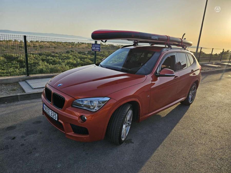 Orange BMW X1 2014 in Marijampole, with an engine capacity of 2.00 L and mileage of 215 thousand km for 10700 €, photo 9 on AUTOMOTO.COM.LV