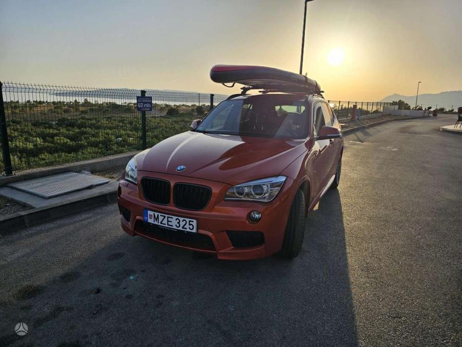 Orange BMW X1 2014 in Marijampole, with an engine capacity of 2.00 L and mileage of 215 thousand km for 10700 €, photo 11 on AUTOMOTO.COM.LV