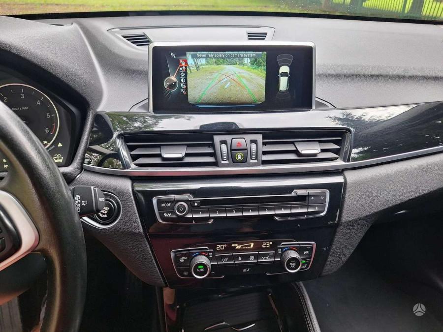 White BMW X1 2016 in Utena, with an engine capacity of 2.00 L and mileage of 207 thousand km for 12650 €, photo 18 on AUTOMOTO.COM.LV