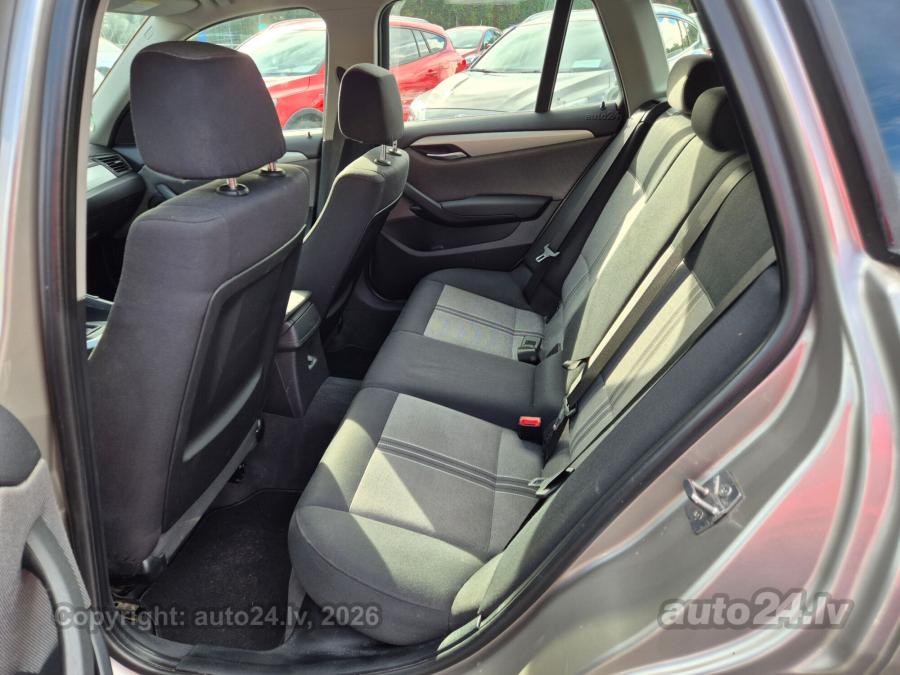 Желтый БМВ Х1 2010 в Тарту, объемом двигателя 2.00 л и пробегом 200 тыс. км за 7990 €, фото 14 на AUTOMOTO.COM.LV