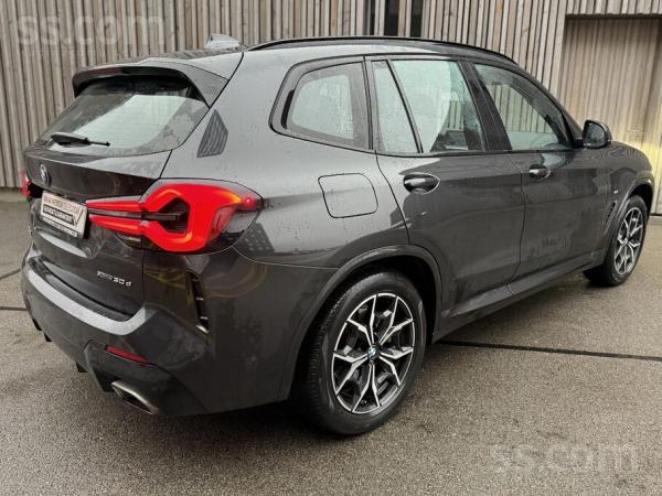 Black BMW X3 2022 in Riga, with an engine capacity of 3.00 L and mileage of 134 thousand km for 33999 €, photo 4 on AUTOMOTO.COM.LV