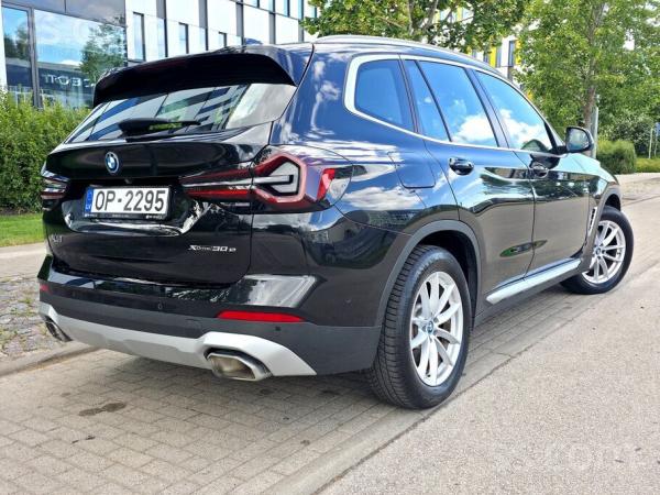 Black BMW X3 2022 in Riga, with an engine capacity of 2.00 L and mileage of 128 thousand km for 29990 €, photo 7 on AUTOMOTO.COM.LV