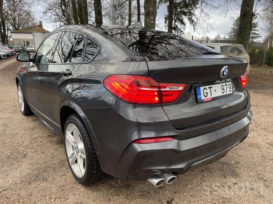 Black BMW X4 2014 in Riga, with an engine capacity of 3.00 L and mileage of 257 thousand km for 14990 €, photo 4 on AUTOMOTO.COM.LV
