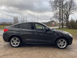 Black BMW X4 2014 in Riga, with an engine capacity of 3.00 L and mileage of 257 thousand km for 14990 €, photo 7 on AUTOMOTO.COM.LV
