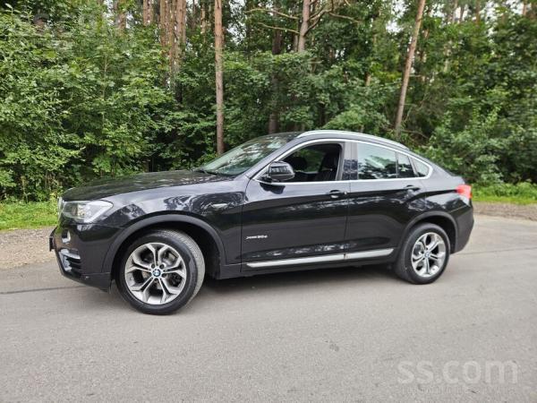 Black BMW X4 2014 in Riga, with an engine capacity of 3.00 L and mileage of 260 thousand km for 14950 €, photo 4 on AUTOMOTO.COM.LV