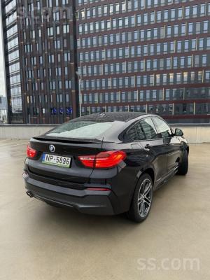 Black BMW X4 2015 in Riga, with an engine capacity of 3.00 L and mileage of 242 thousand km for 21000 €, photo 5 on AUTOMOTO.COM.LV