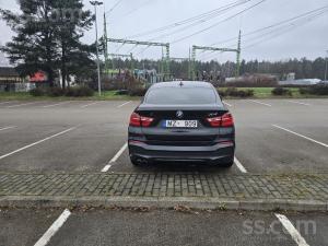 Black BMW X4 2015 in Riga, with an engine capacity of 3.00 L and mileage of 289 thousand km for 19500 €, photo 5 on AUTOMOTO.COM.LV