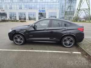 Black BMW X4 2015 in Riga, with an engine capacity of 3.00 L and mileage of 289 thousand km for 19500 €, photo 7 on AUTOMOTO.COM.LV
