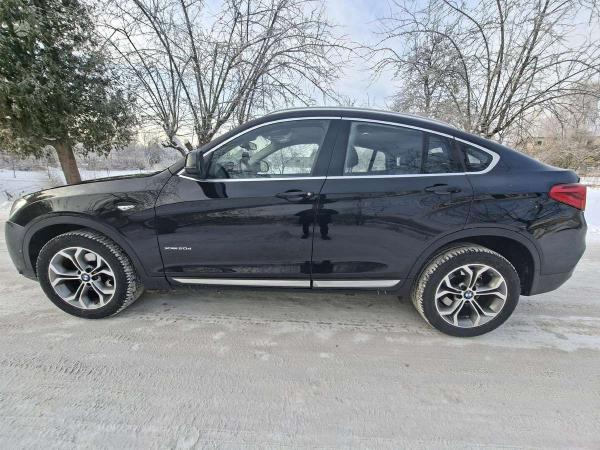 Black BMW X4 2015 in Panevezys, with an engine capacity of 2.00 L and mileage of 248 thousand km for 17300 €, photo 6 on AUTOMOTO.COM.LV