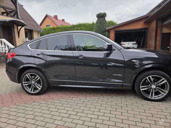 Black BMW X4 2015 in Pagegiai, with an engine capacity of 2.99 L and mileage of 150 thousand km for 17500 €, photo 2 on AUTOMOTO.COM.LV
