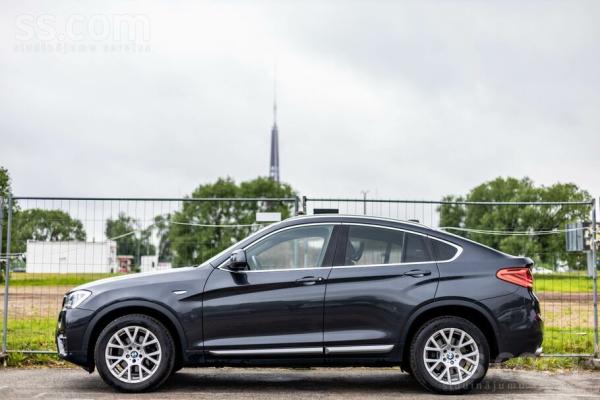 Black BMW X4 2016 in Riga, with an engine capacity of 3.00 L and mileage of 291 thousand km for 18990 €, photo 4 on AUTOMOTO.COM.LV