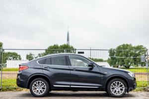 Black BMW X4 2016 in Riga, with an engine capacity of 3.00 L and mileage of 291 thousand km for 18990 €, photo 5 on AUTOMOTO.COM.LV
