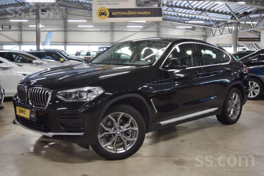 Black BMW X4 2021 in Riga, with an engine capacity of 2.00 L and mileage of 108 thousand km for 33500 €, photo 1 on AUTOMOTO.COM.LV