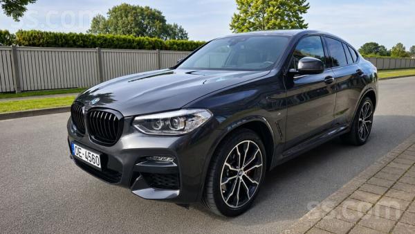 Black BMW X4 2021 in Riga, with an engine capacity of 2.00 L and mileage of 127 thousand km for 36900 €, photo 1 on AUTOMOTO.COM.LV