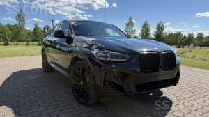 Black BMW X4 2022 in Riga, with an engine capacity of 2.00 L and mileage of 100 thousand km for 35500 €, photo 9 on AUTOMOTO.COM.LV