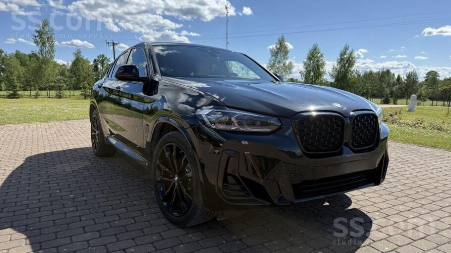 Black BMW X4 2022 in Riga, with an engine capacity of 2.00 L and mileage of 100 thousand km for 35500 €, photo 9 on AUTOMOTO.COM.LV