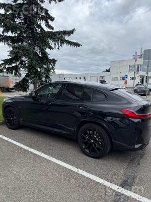 Black BMW X4 2022 in Riga, with an engine capacity of 3.00 L and mileage of 66 thousand km for 51500 €, photo 6 on AUTOMOTO.COM.LV
