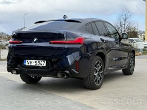 Blue BMW X4 2024 in Riga, with an engine capacity of 2.00 L and mileage of 15 thousand km for 52900 €, photo 5 on AUTOMOTO.COM.LV