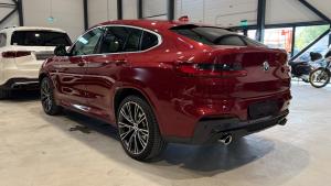 Red BMW X4 2021 in Riga, with an engine capacity of 2.00 L and mileage of 98 thousand km for 34990 €, photo  on AUTOMOTO.COM.LV