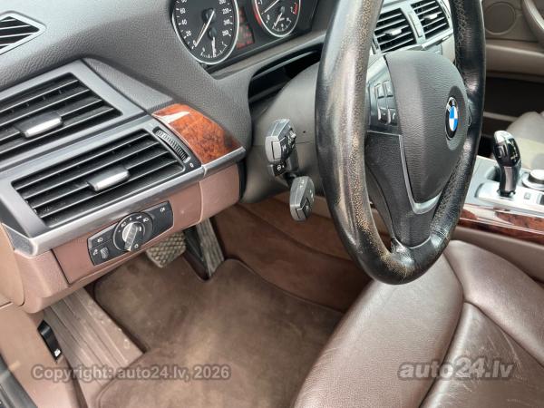 Black BMW X5 2007 in Tartu, with an engine capacity of 4.80 L and mileage of 313 thousand km for 8999 €, photo 7 on AUTOMOTO.COM.LV